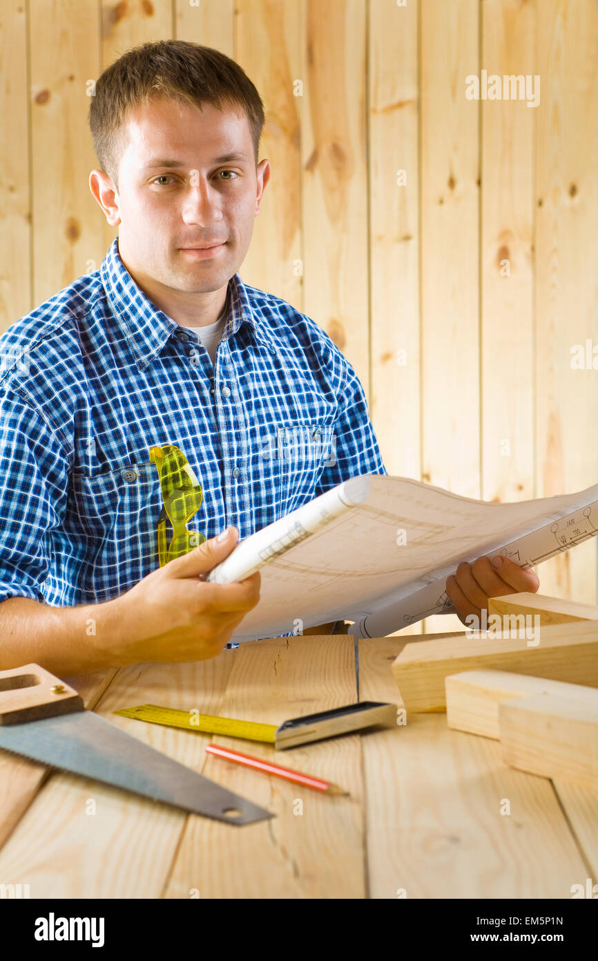 carpenter with blueprint Stock Photo - Alamy