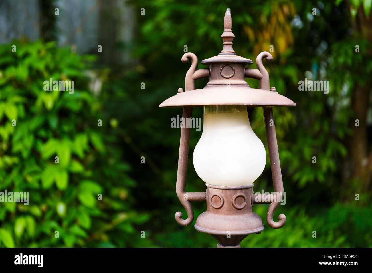 Street lamp in the green garden Stock Photo - Alamy