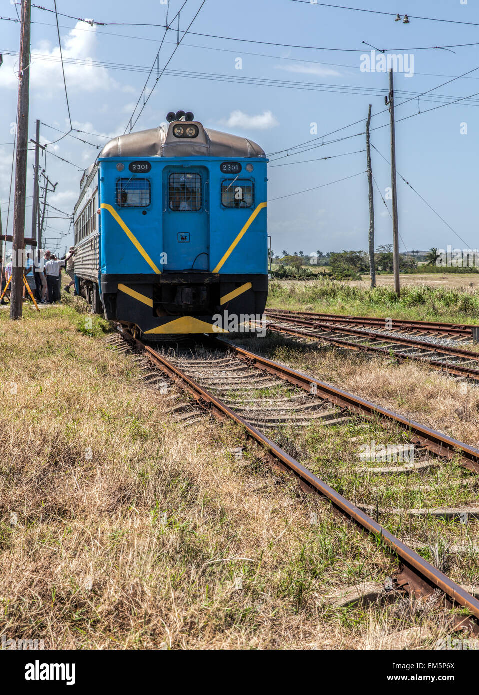 Blue diesel train a rusty iron track in a remote part of Cuba Stock ...