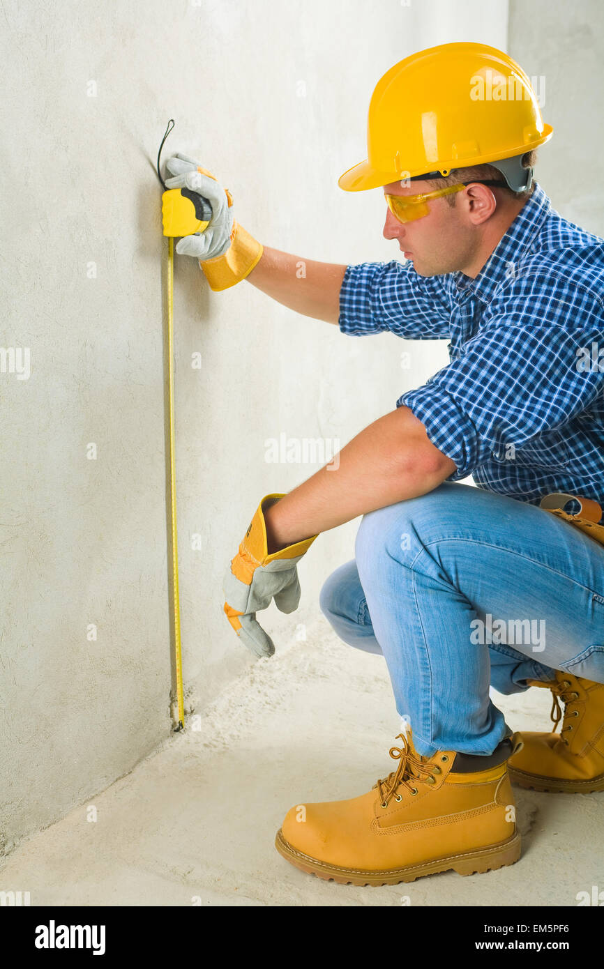 worker with tape measure Stock Photo - Alamy