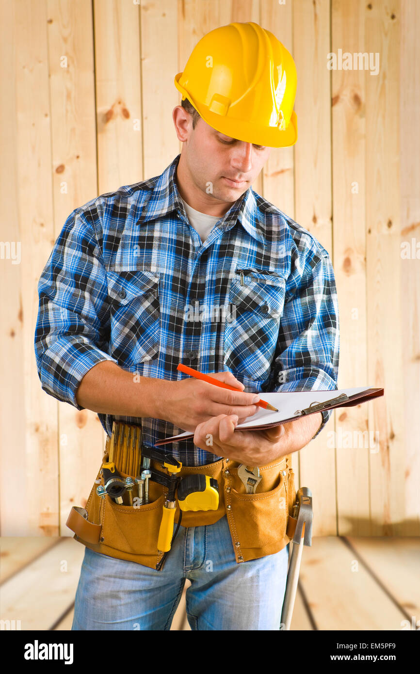 worker write on clipboard Stock Photo - Alamy