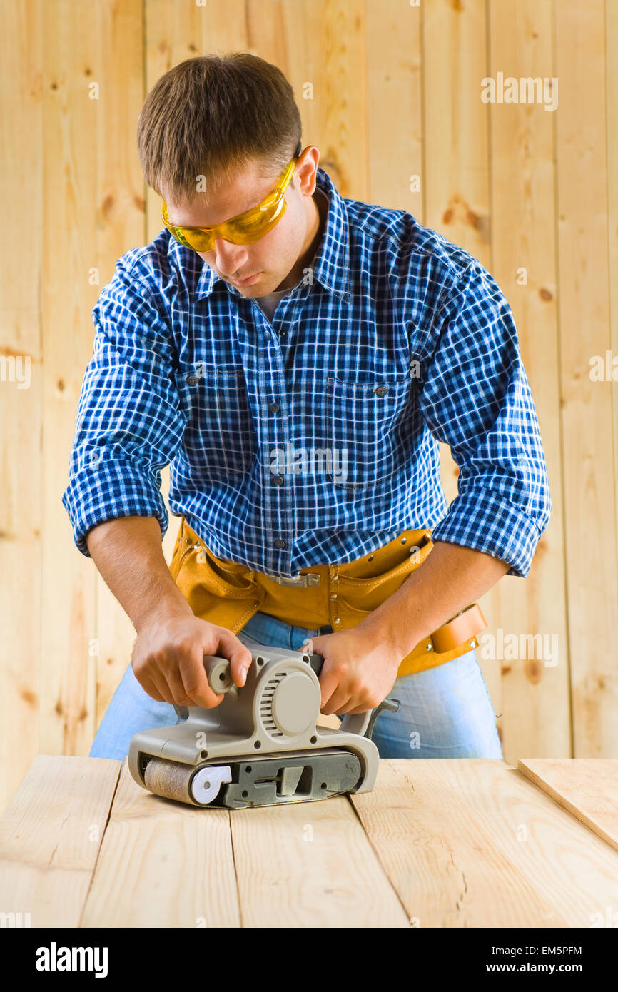 Young worker belt sander hi-res stock photography and images - Alamy