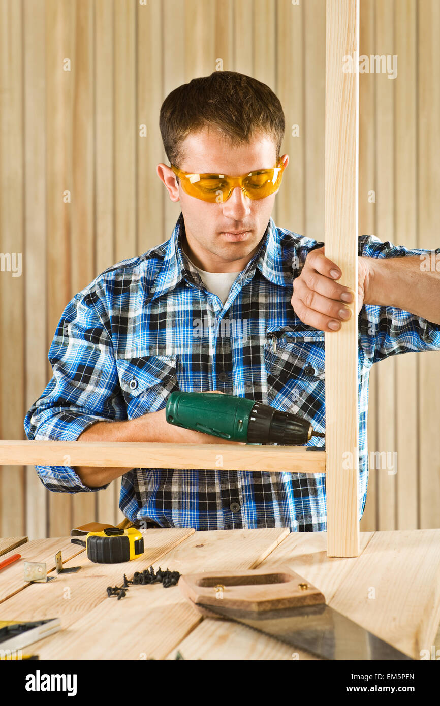 young men works with screwdriver Stock Photo - Alamy