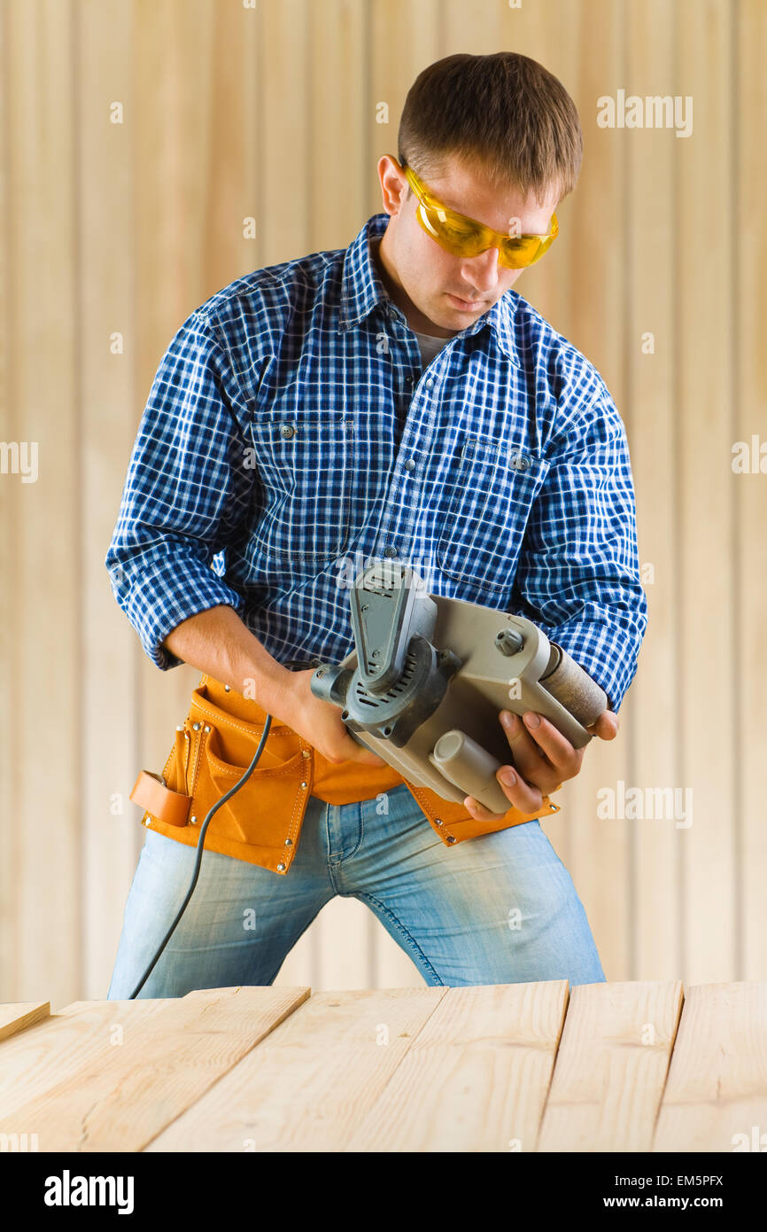 worker adjusting detail sander Stock Photo - Alamy