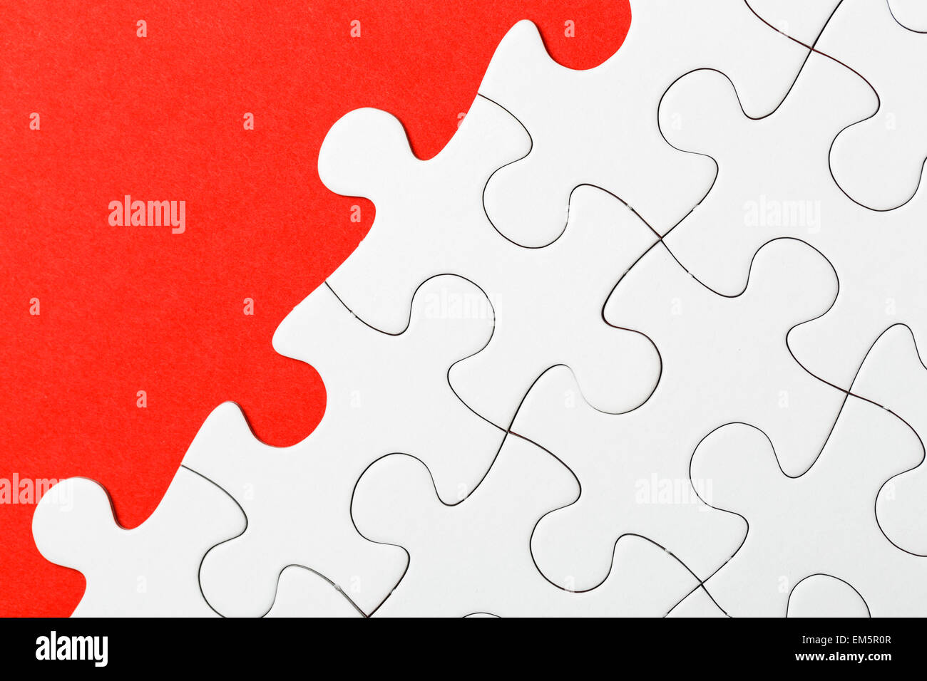 Incomplete puzzle in red color Stock Photo - Alamy