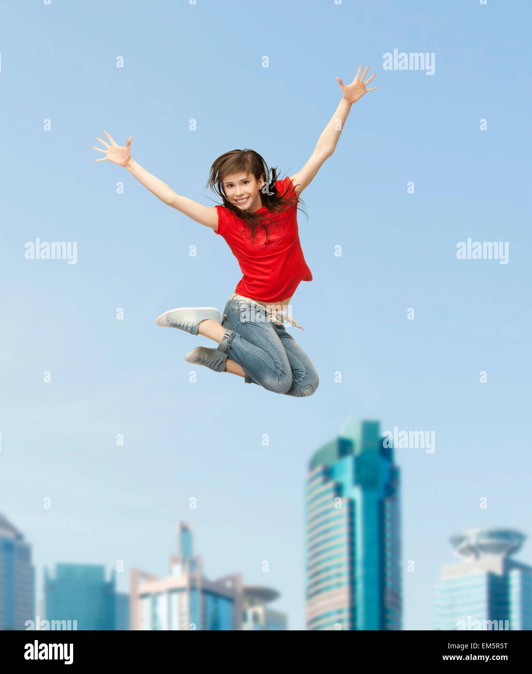 smiling girl jumping Stock Photo - Alamy