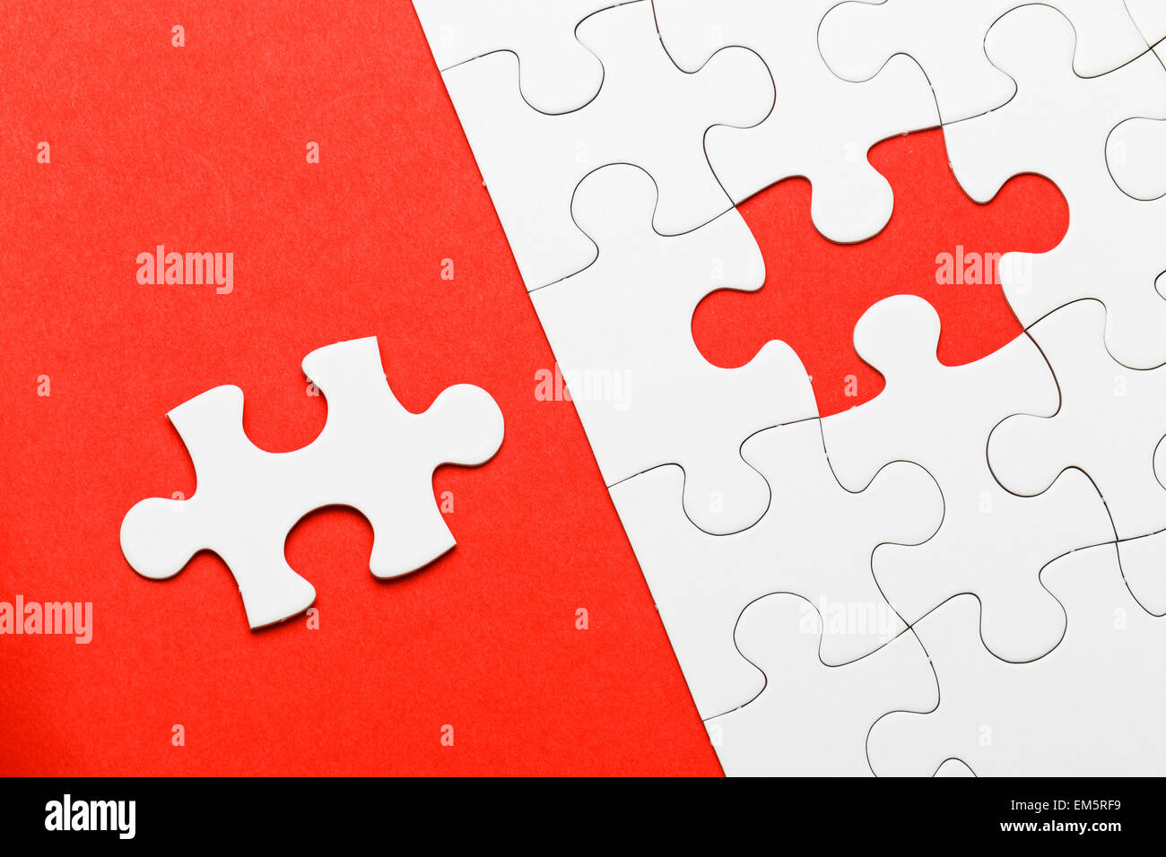Incomplete puzzle with missing piece Stock Photo - Alamy