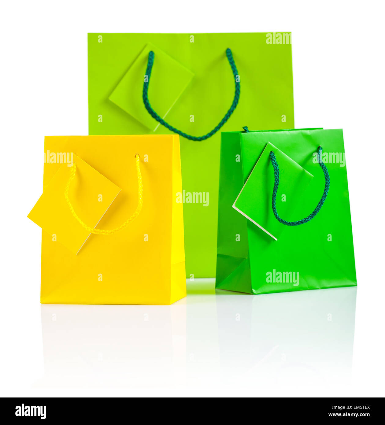 three colored paper bags isolated on white Stock Photo - Alamy