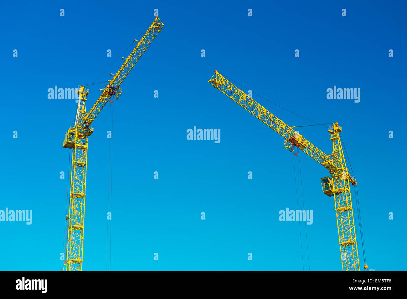 two construction cranes in sky Stock Photo - Alamy