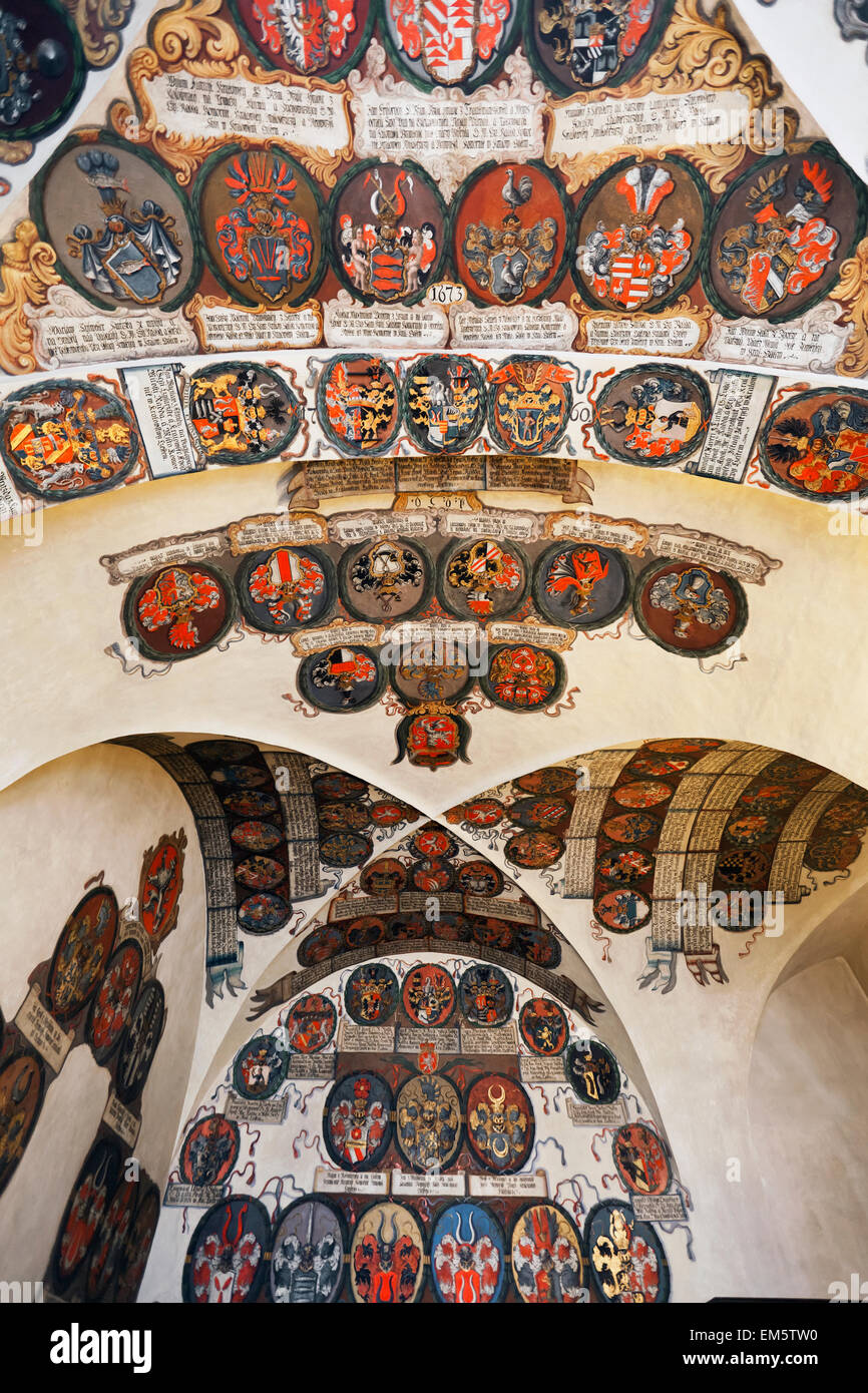 Czech Republic, Colorful crests displayed on curved ceiling and walls ...