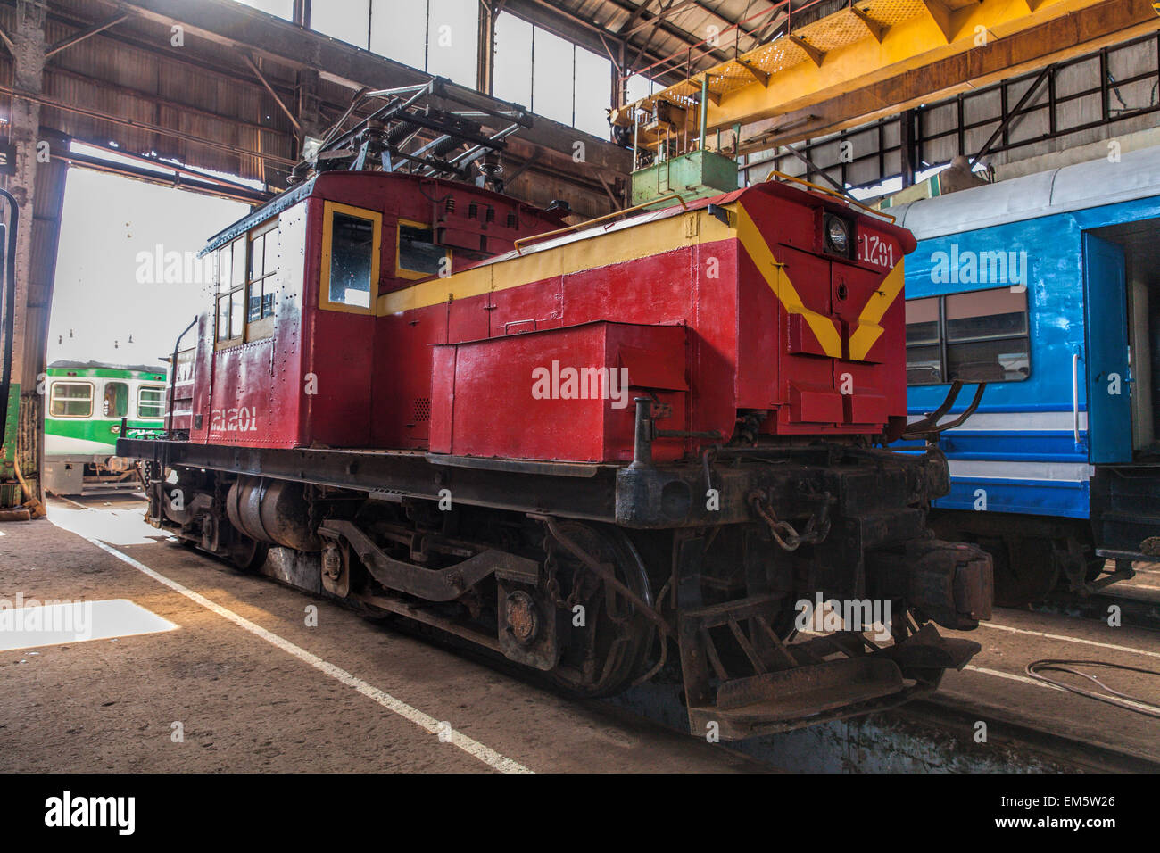 Old red & yellow repaired train from the side & rear at the Central ...