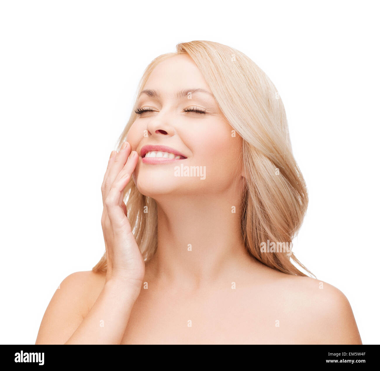 smiling beautiful womant touching her cheek Stock Photo - Alamy