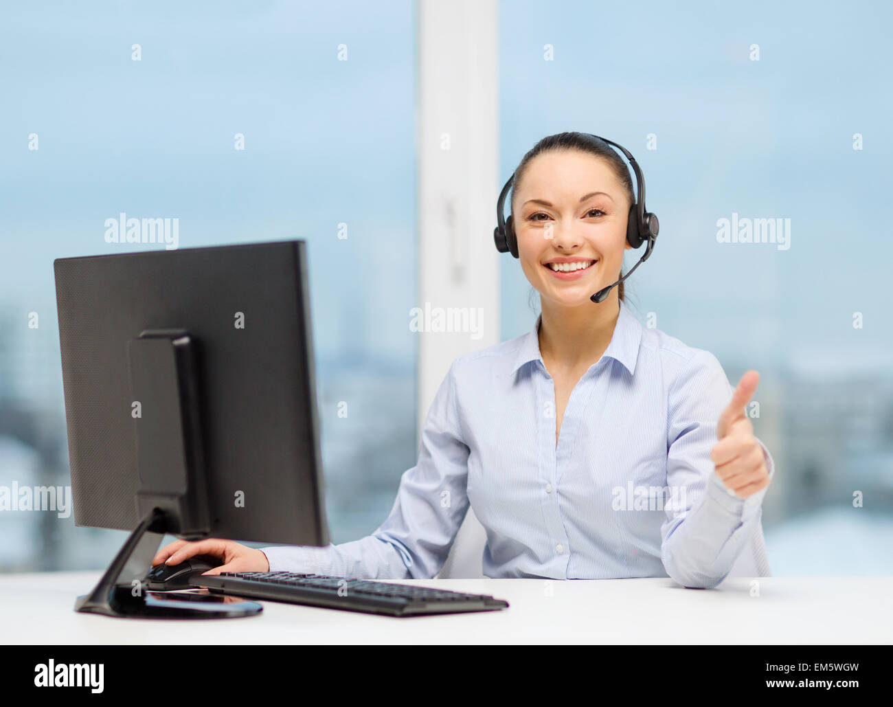female helpline operator showing thumbs up Stock Photo - Alamy