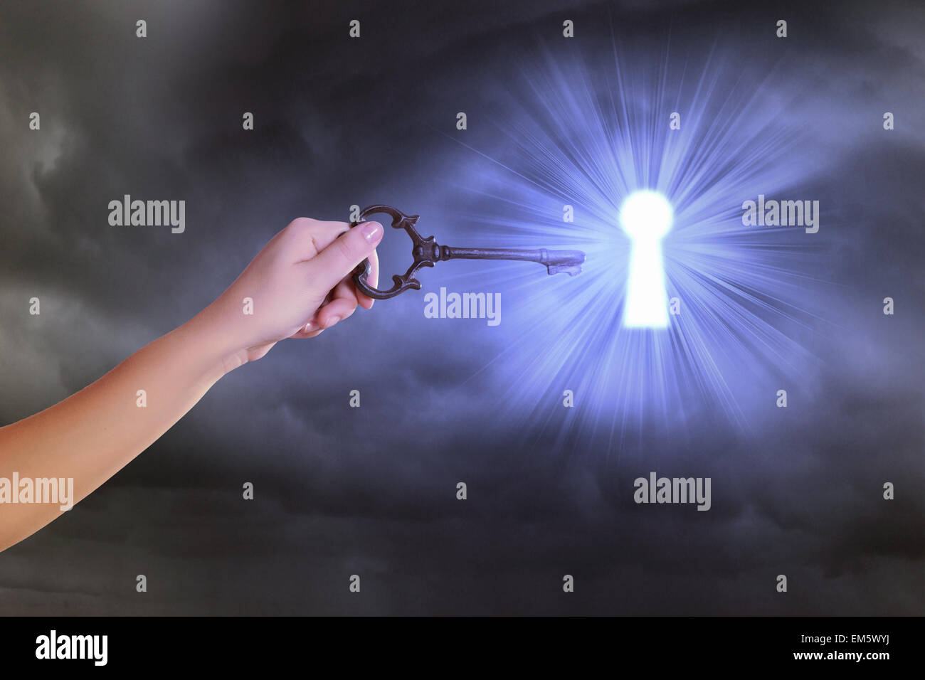 Hand with key Stock Photo - Alamy