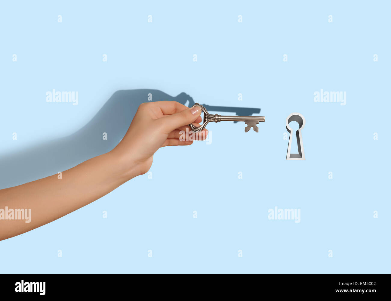 Hand with key Stock Photo - Alamy