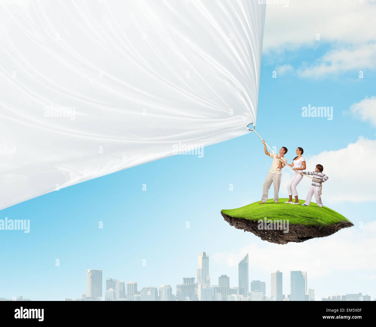 Young family pulling banner Stock Photo - Alamy