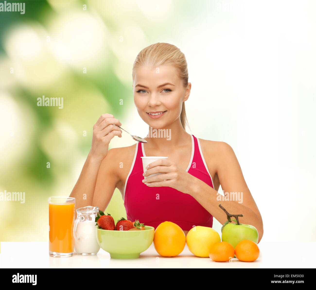 young woman eating healthy breakfast Stock Photo - Alamy
