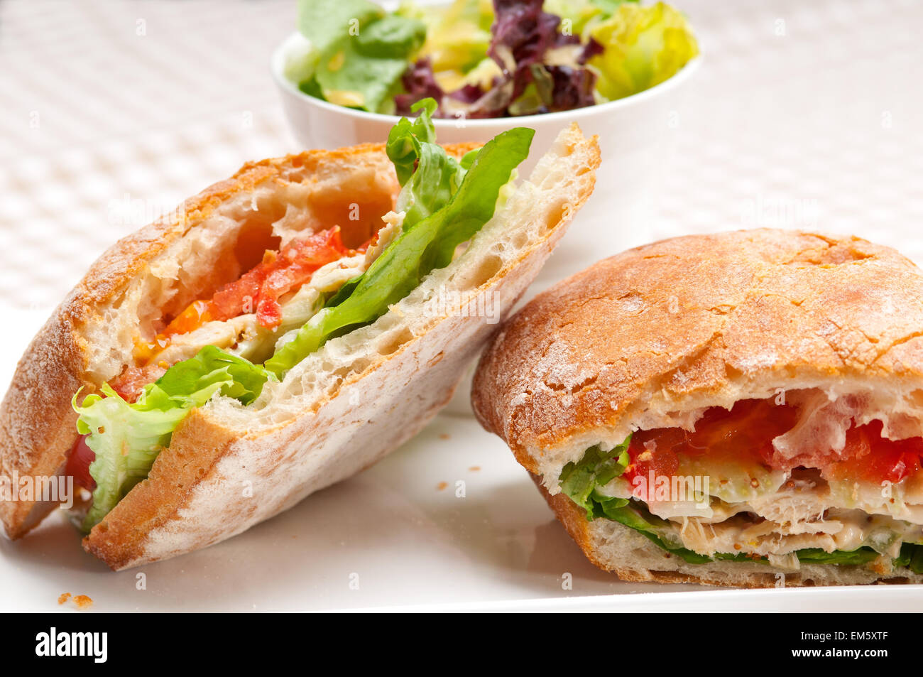 ciabatta panini sandwich with chicken and tomato Stock Photo - Alamy