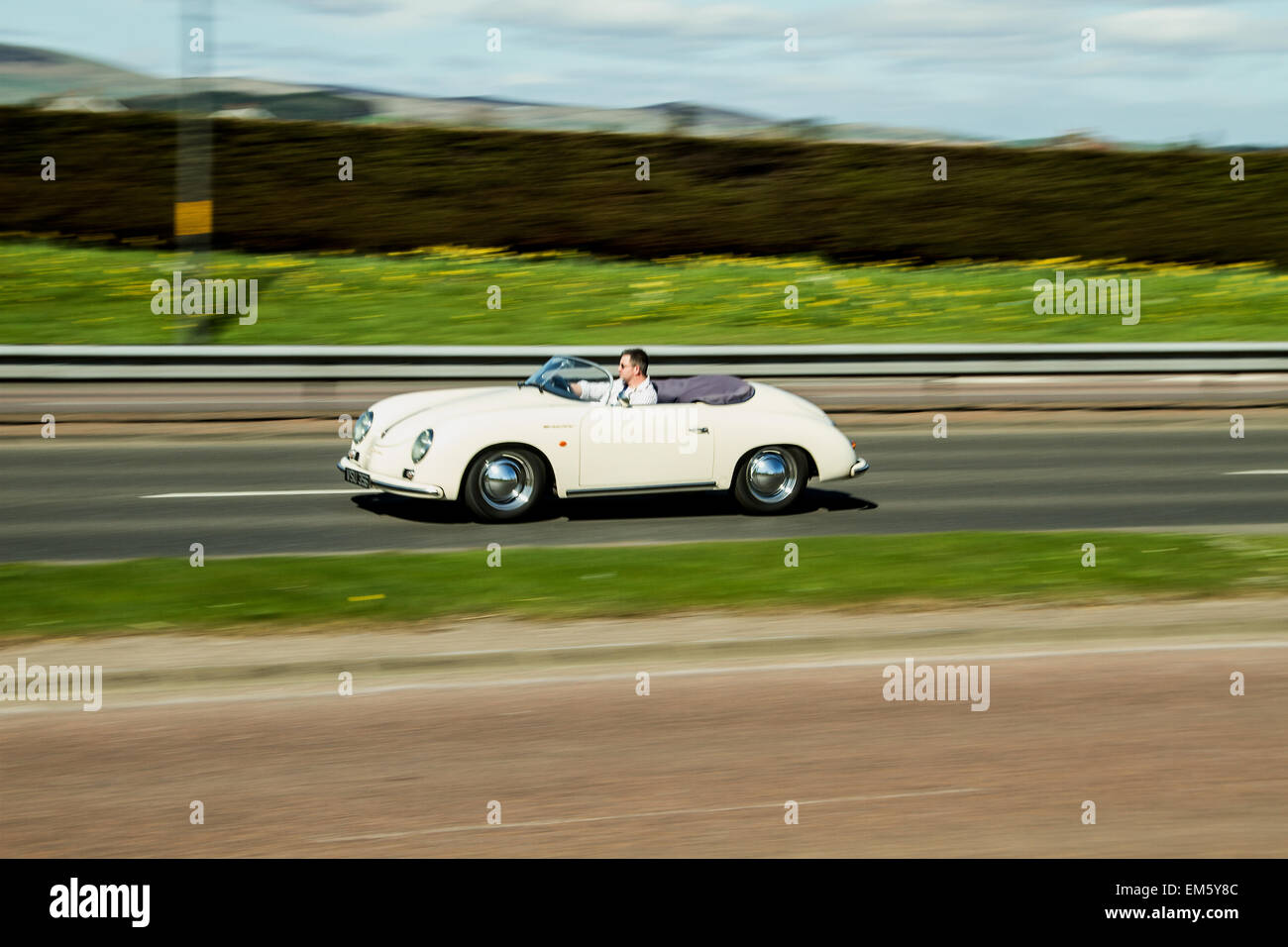 A 1960`s Porsche Convertible sports car travelling along the Kingsway ...
