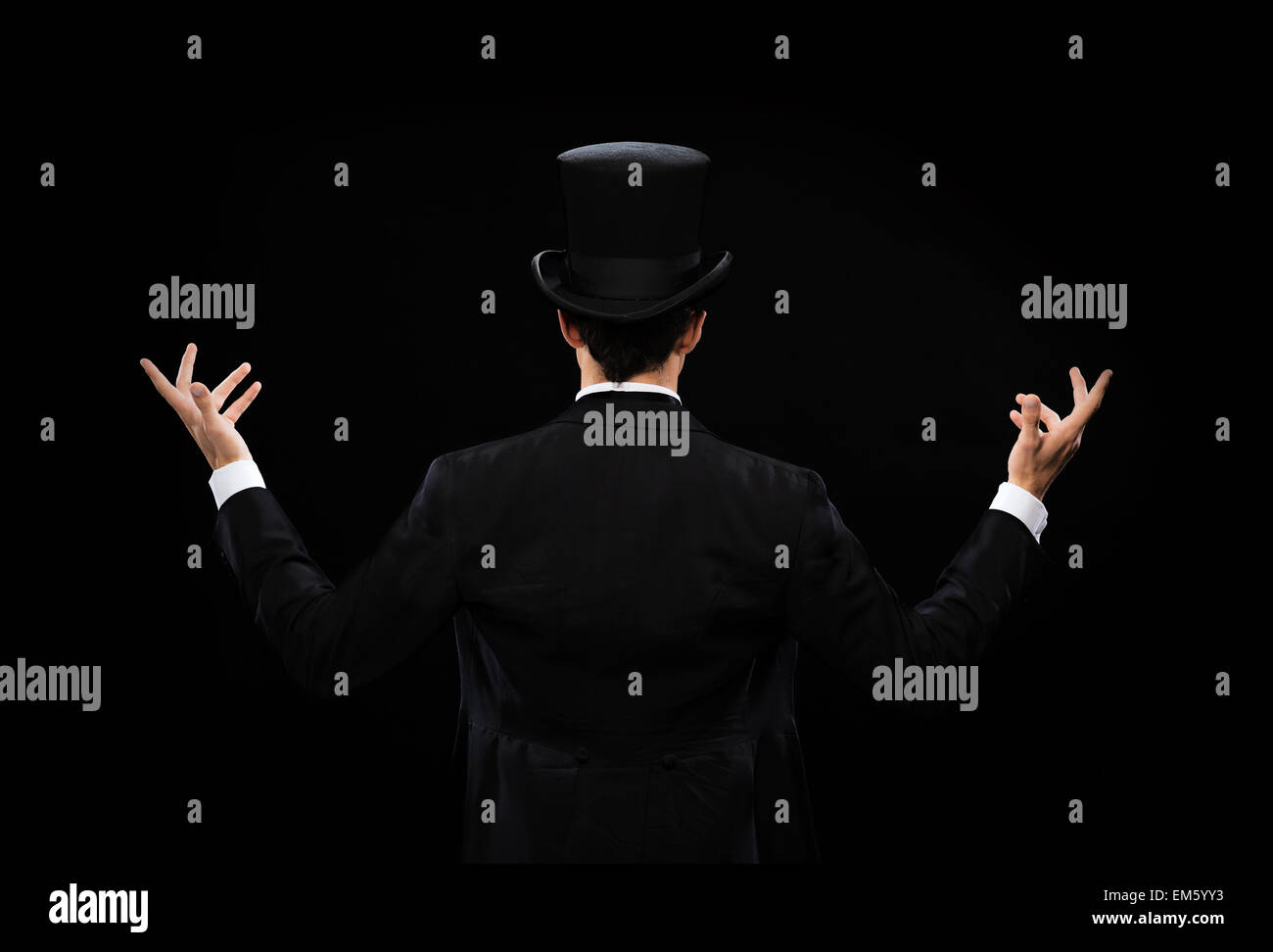 magician in top hat showing trick from the back Stock Photo - Alamy