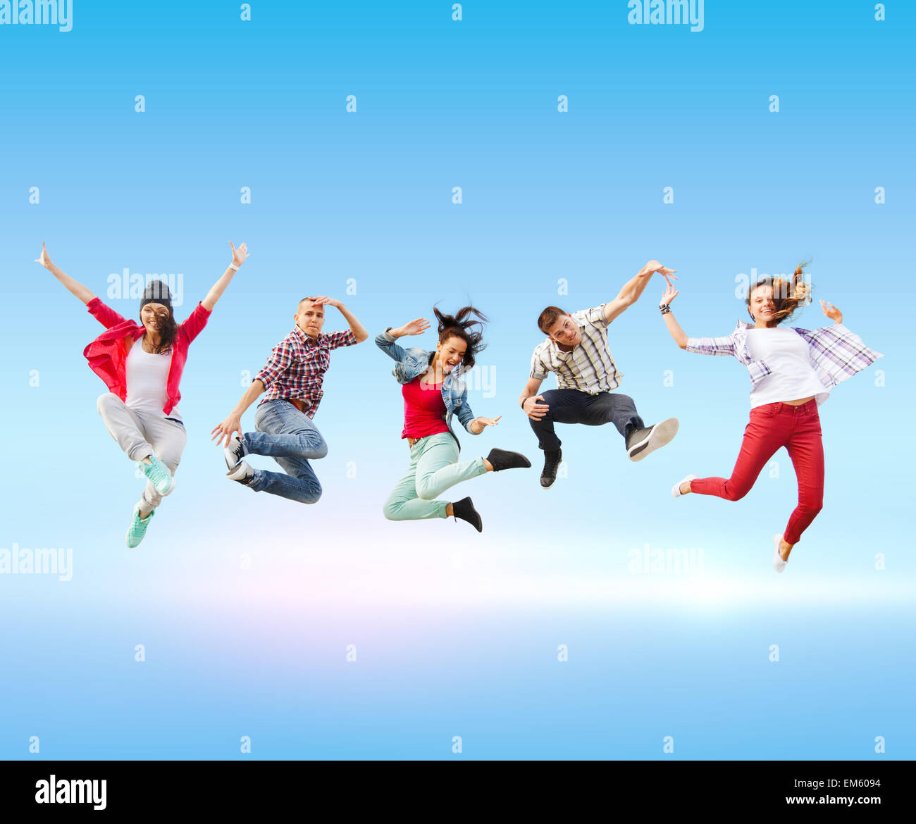 group of teenagers jumping Stock Photo - Alamy