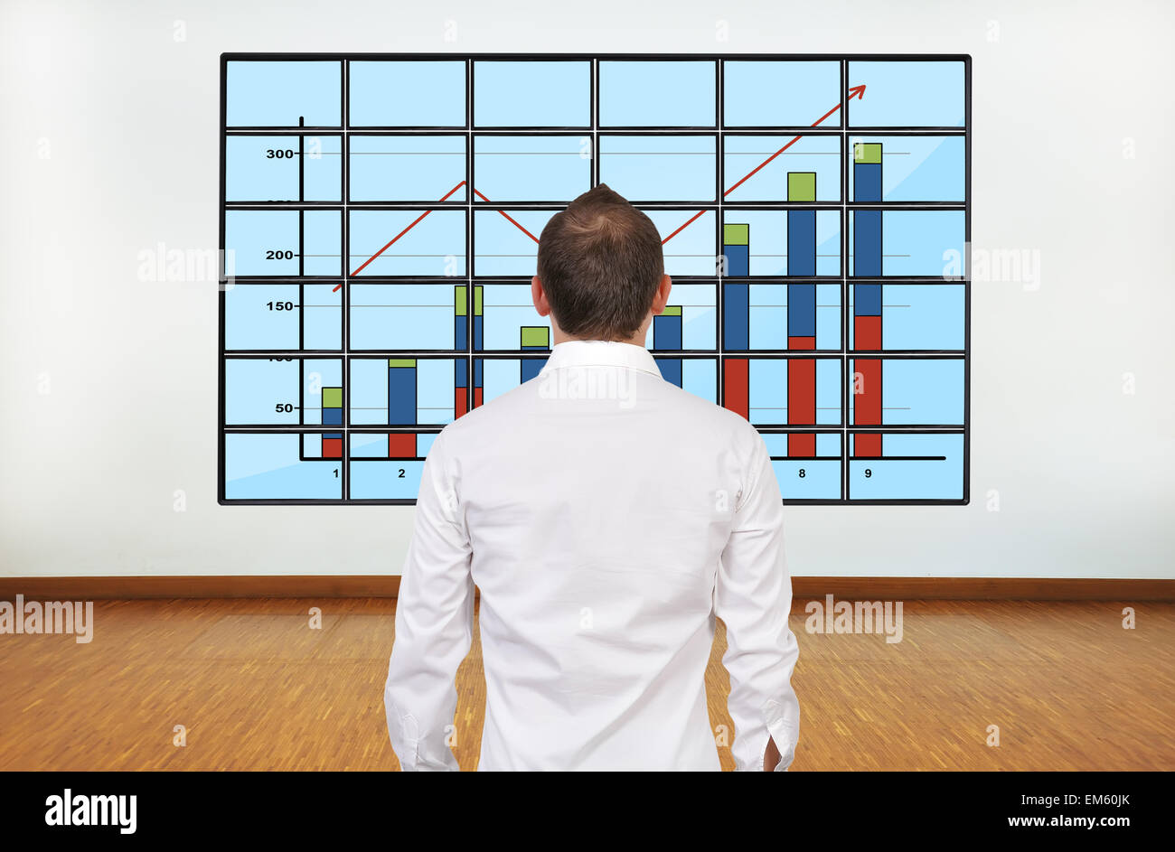 man looking at graphic Stock Photo - Alamy