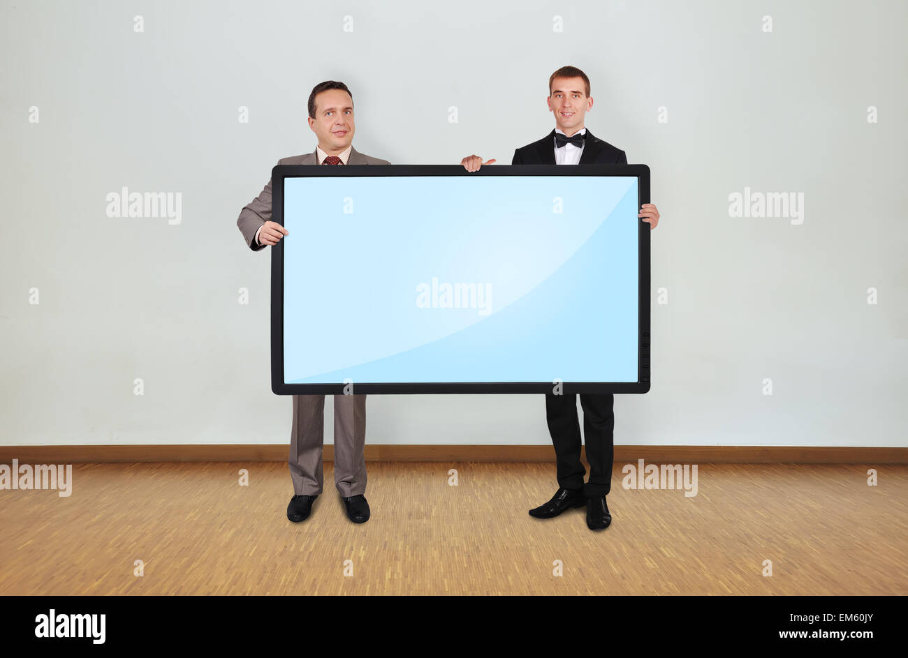 two man holding plasma Stock Photo - Alamy