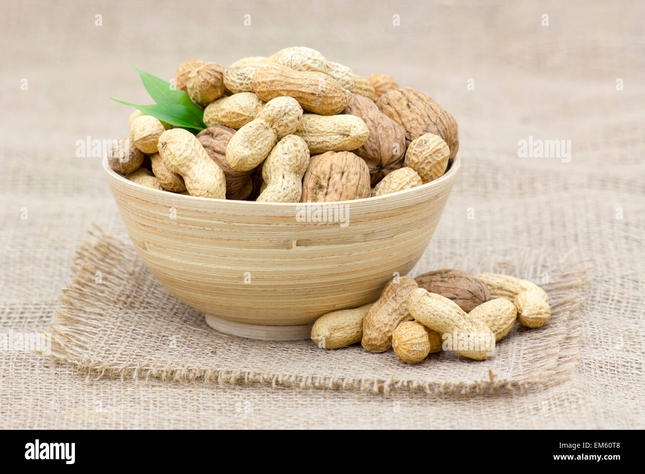 walnuts and peanuts in a bowl Stock Photo - Alamy
