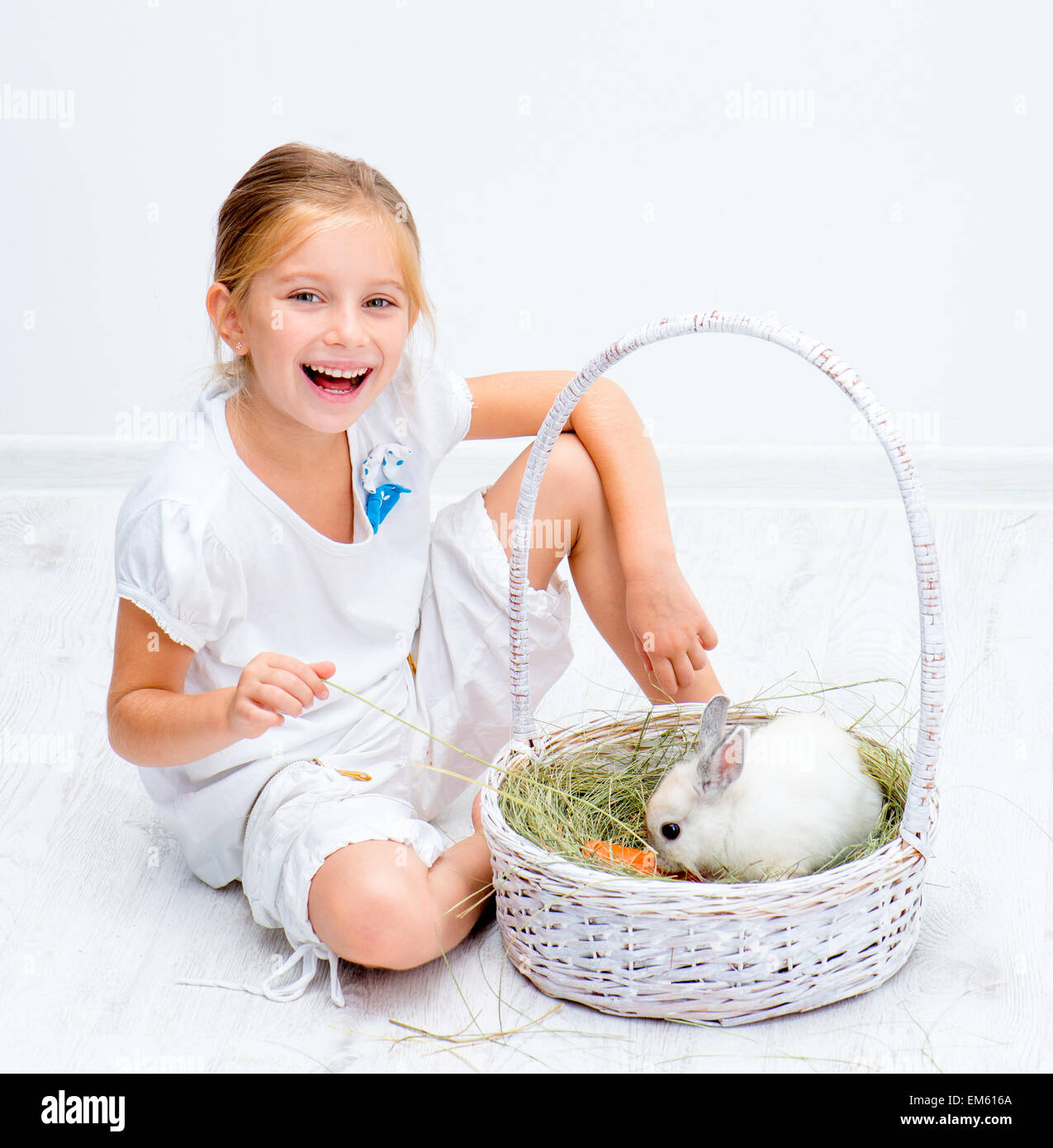Little girl with a rabbit Stock Photo - Alamy