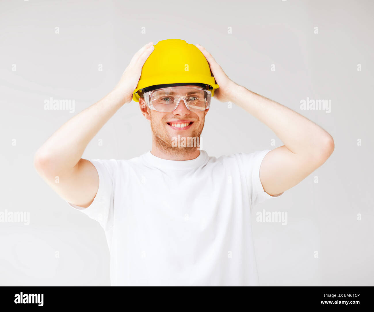 Yellow workman helmet hi-res stock photography and images - Alamy