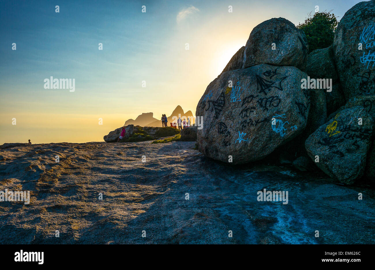 Brazil, Rio De Janeiro, people on the Pedra do Arpoador promontory at ...