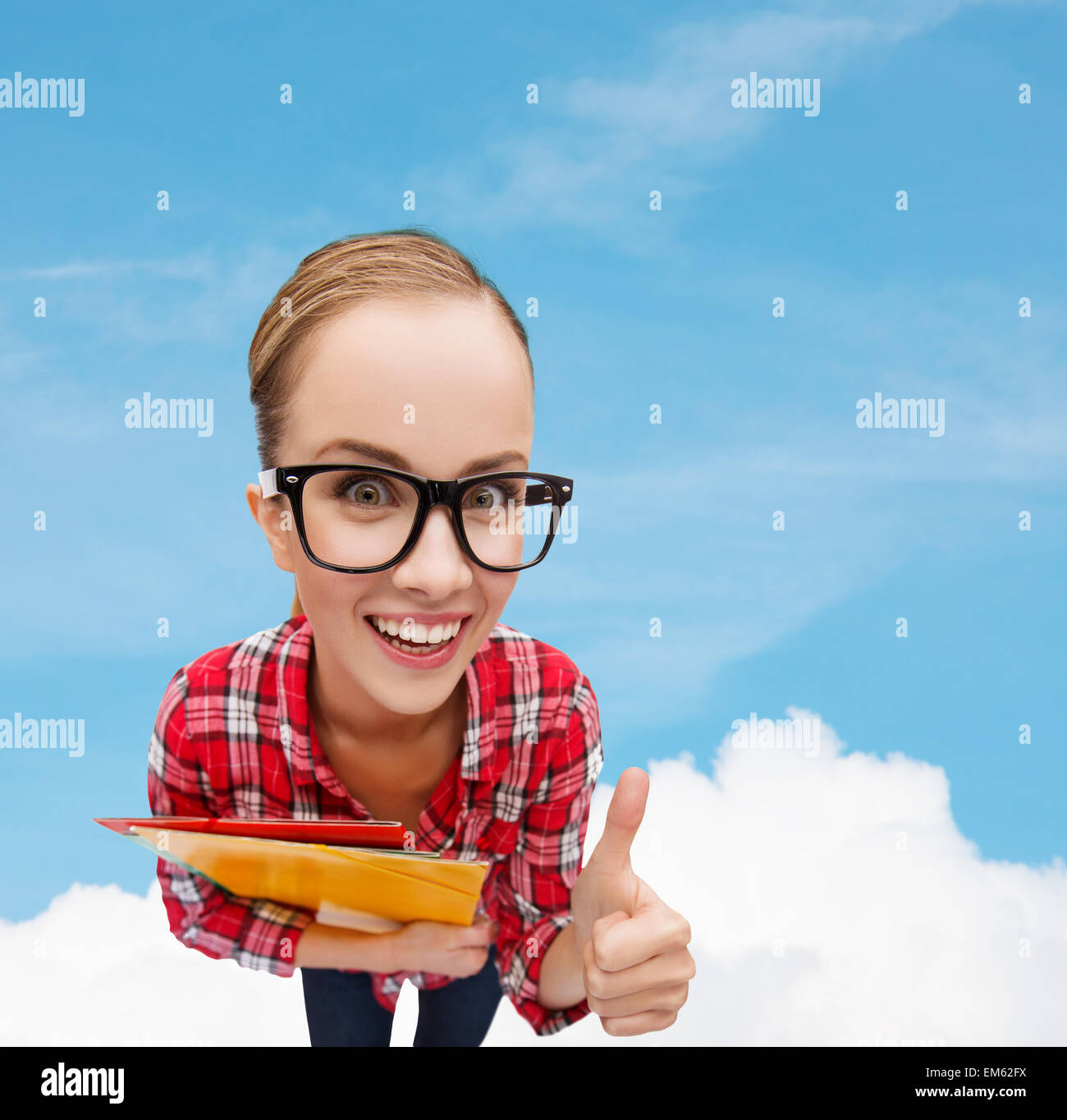 student in glasses with folders showing thumbs up Stock Photo - Alamy