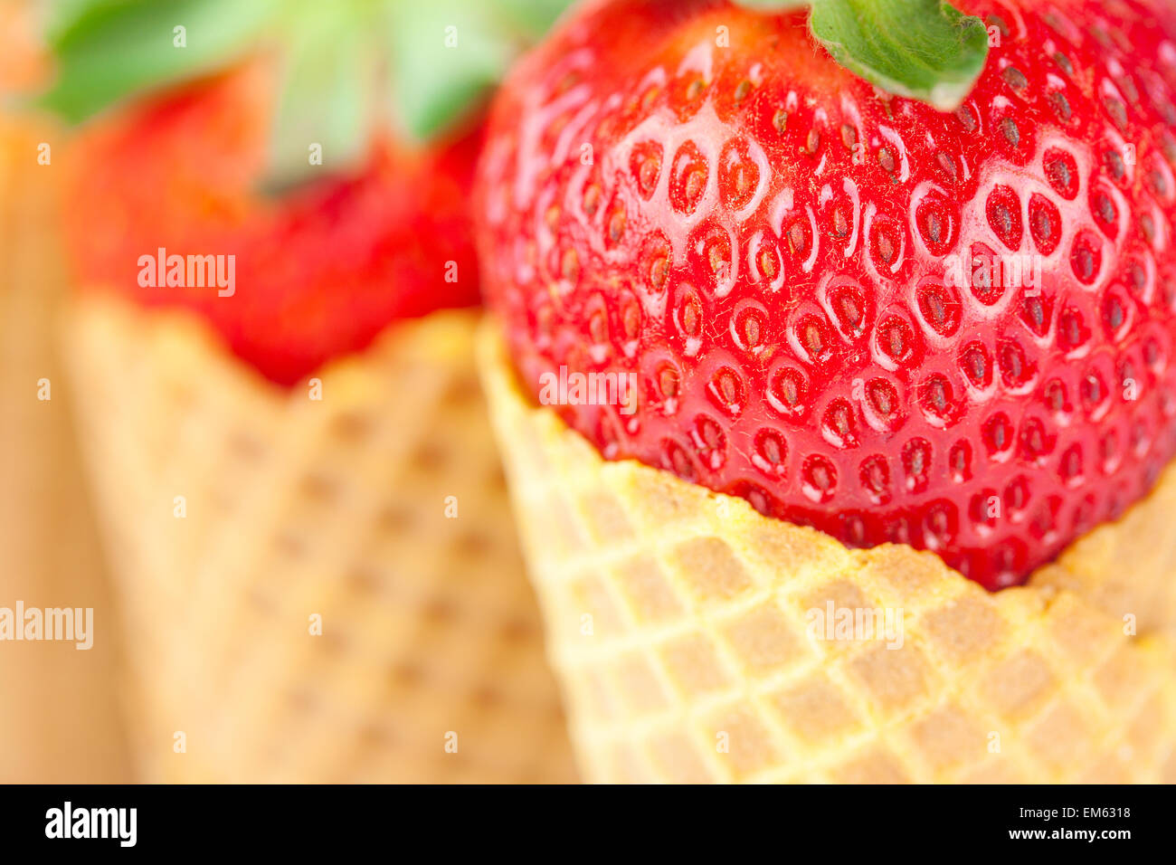 strawberry in a waffle cone closeup Stock Photo - Alamy