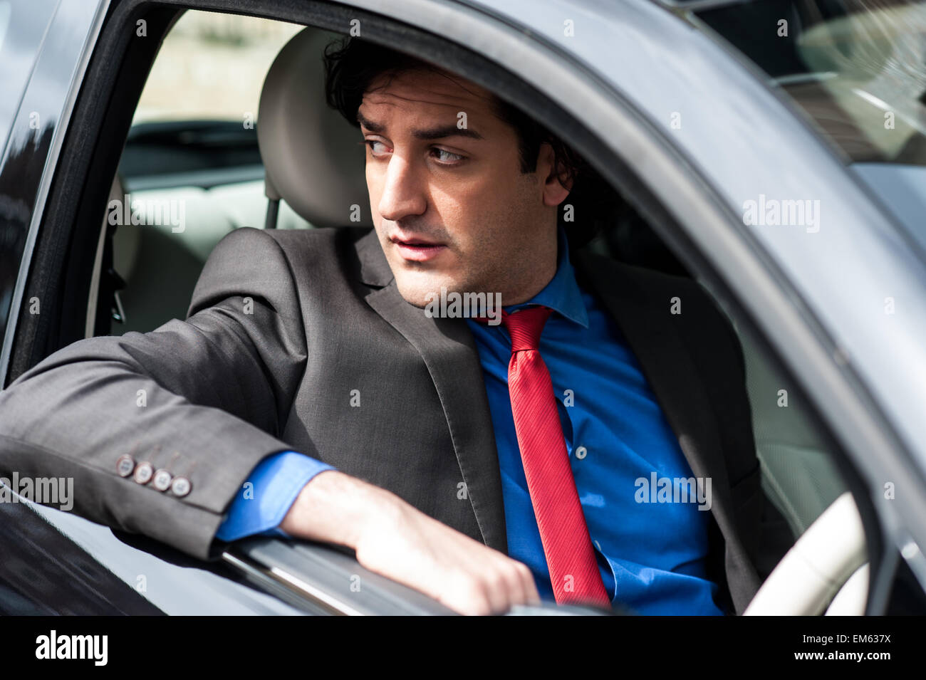 Handsome man driving his new car safely Stock Photo - Alamy