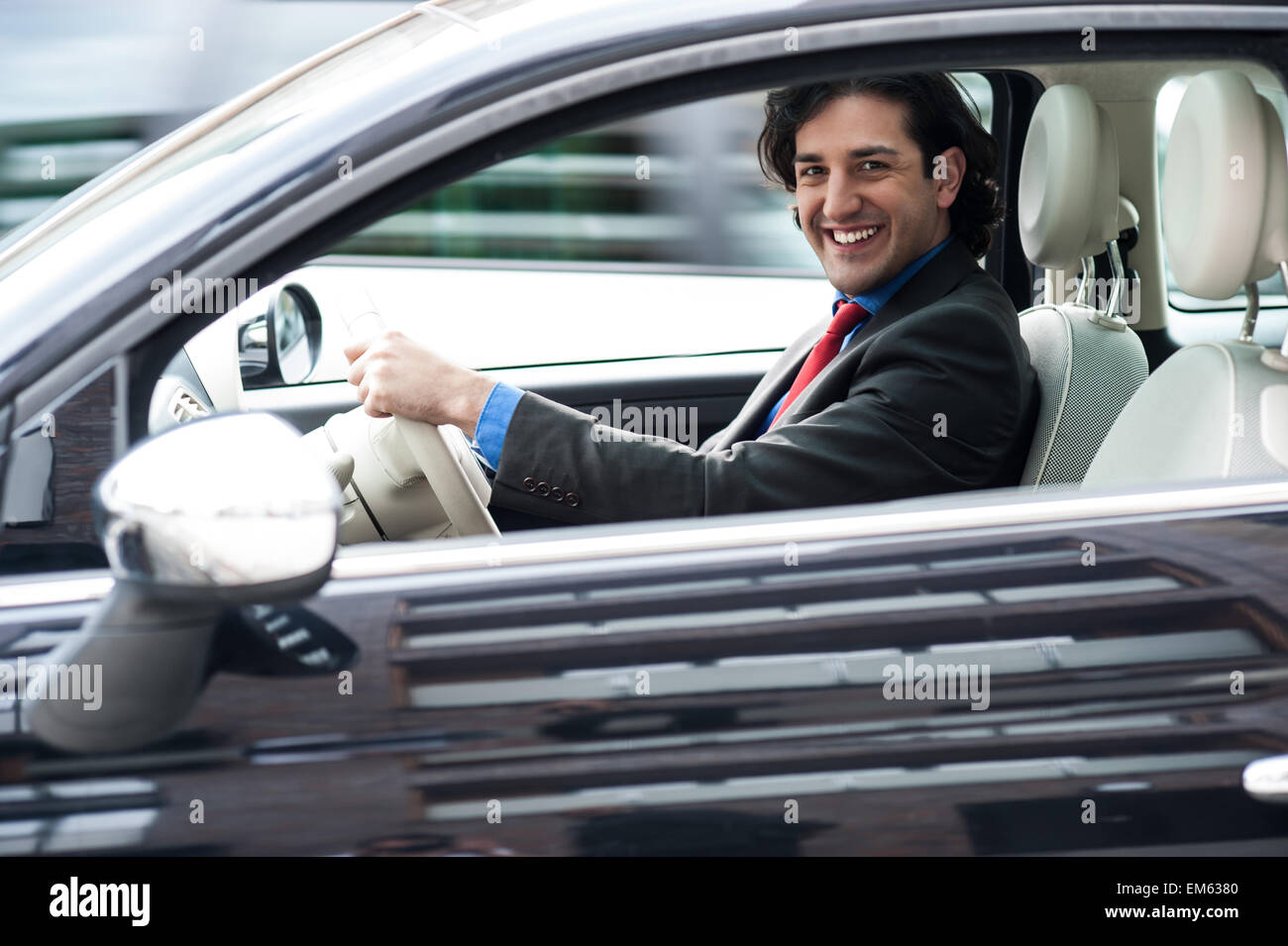 Corporate man driving his car Stock Photo - Alamy