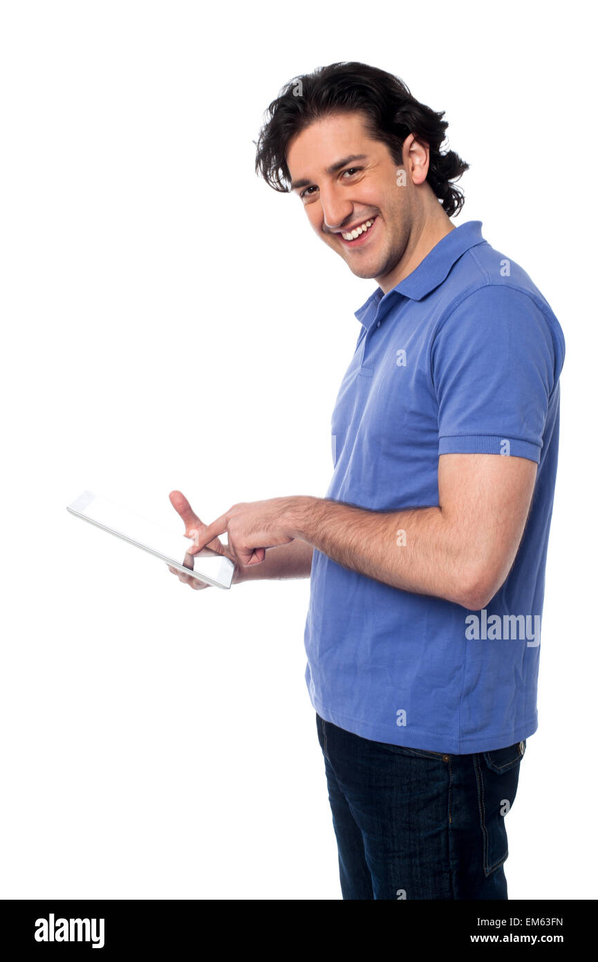 Modern young man browsing internet Cut Out Stock Images & Pictures - Alamy