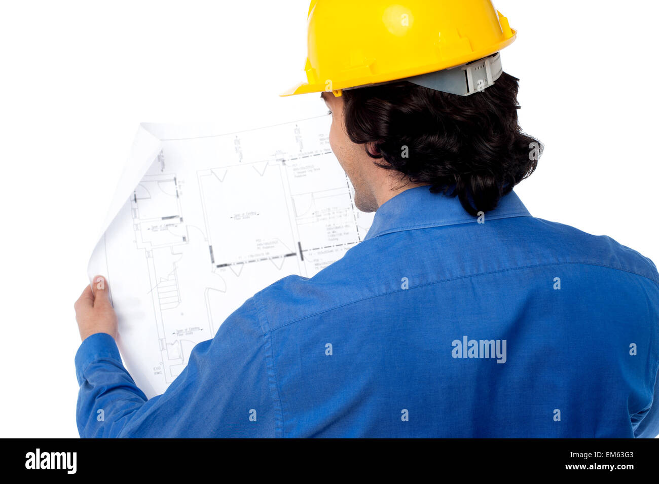 Civil engineer reviewing blueprint Stock Photo - Alamy