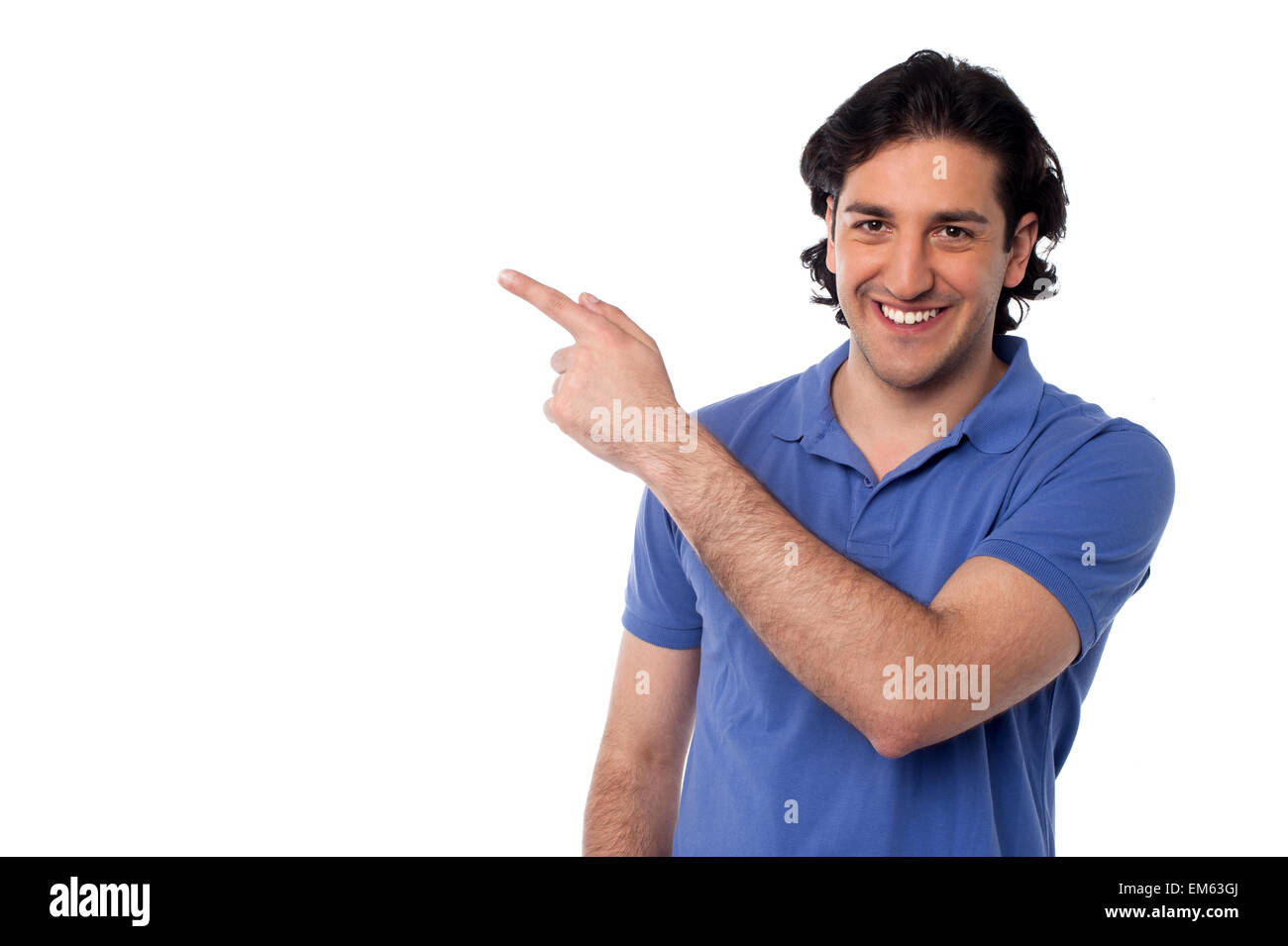Handsome man pointing at something Stock Photo - Alamy