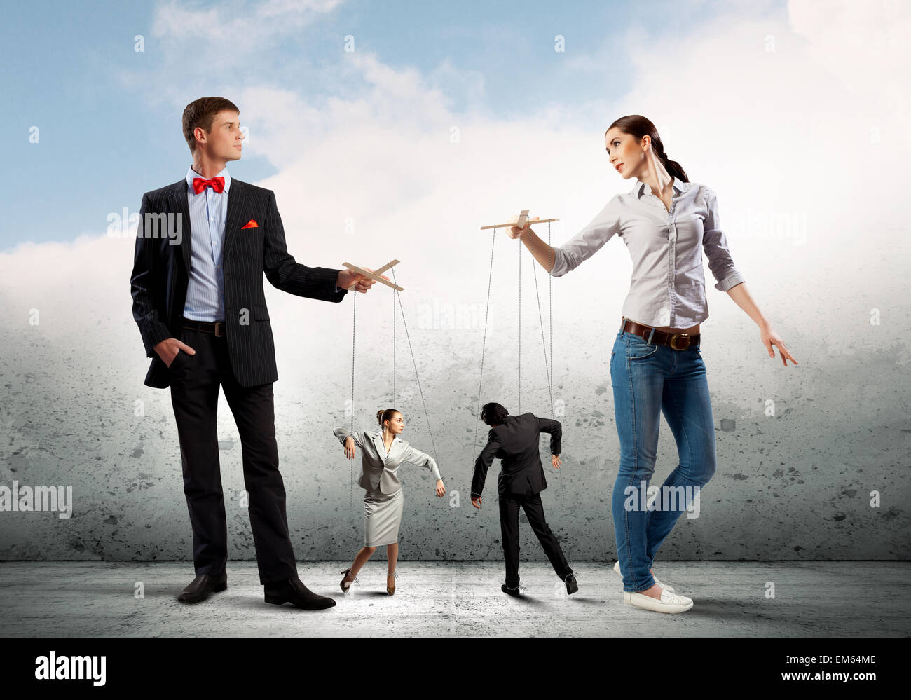 Businesspeople with marionettes Stock Photo - Alamy