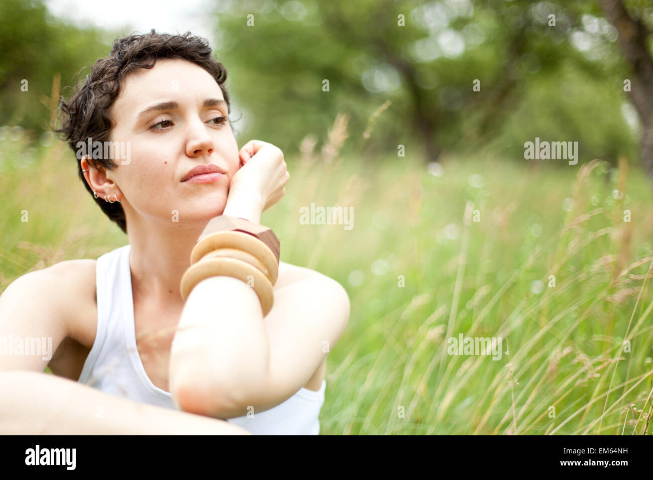 cute girl on green field Stock Photo - Alamy