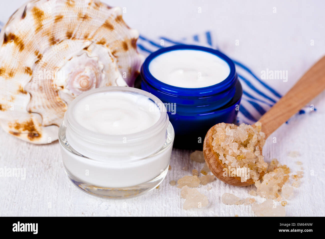 face cream in jars with sea salt and shell Stock Photo - Alamy