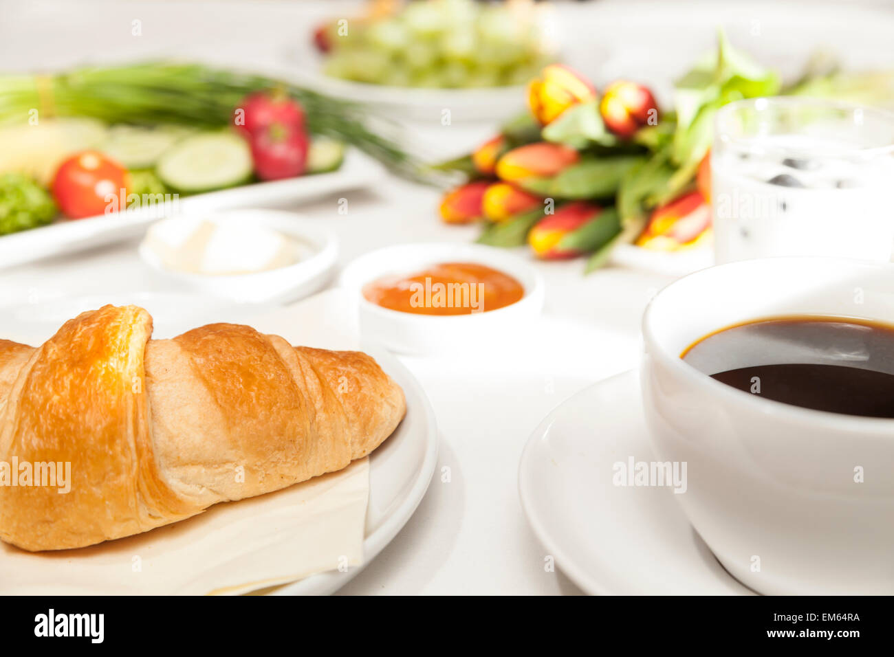 Breakfast table with croissant and coffee Stock Photo - Alamy