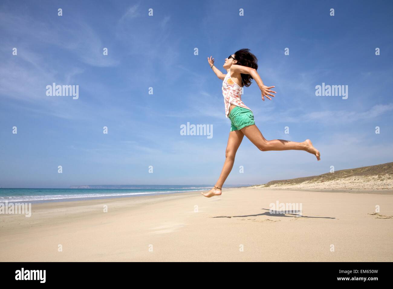 big jump on sandy beach Stock Photo - Alamy