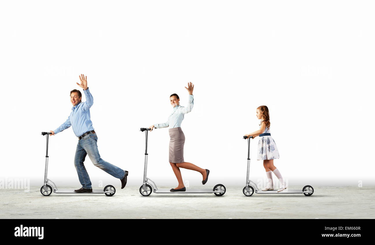 Happy family riding on scooter Stock Photo - Alamy