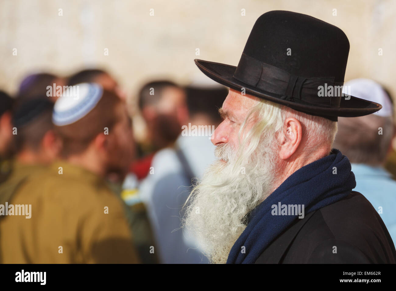 Israel, Side view of man with Wailing wall in background; Jerusalem ...