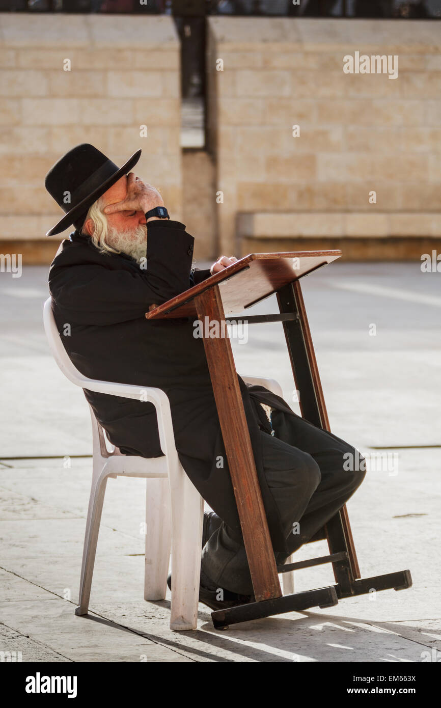 Israel, Side view of man with Wailing wall in background; Jerusalem ...