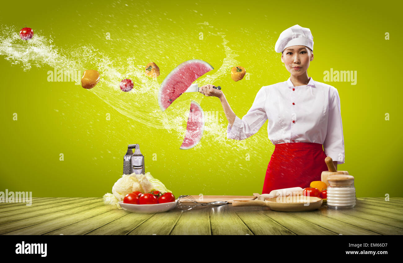 Asian female cook with knife Stock Photo - Alamy