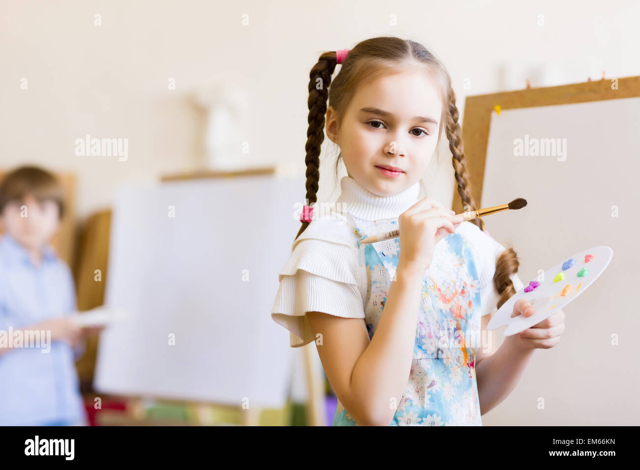 Cute girl painting Stock Photo - Alamy