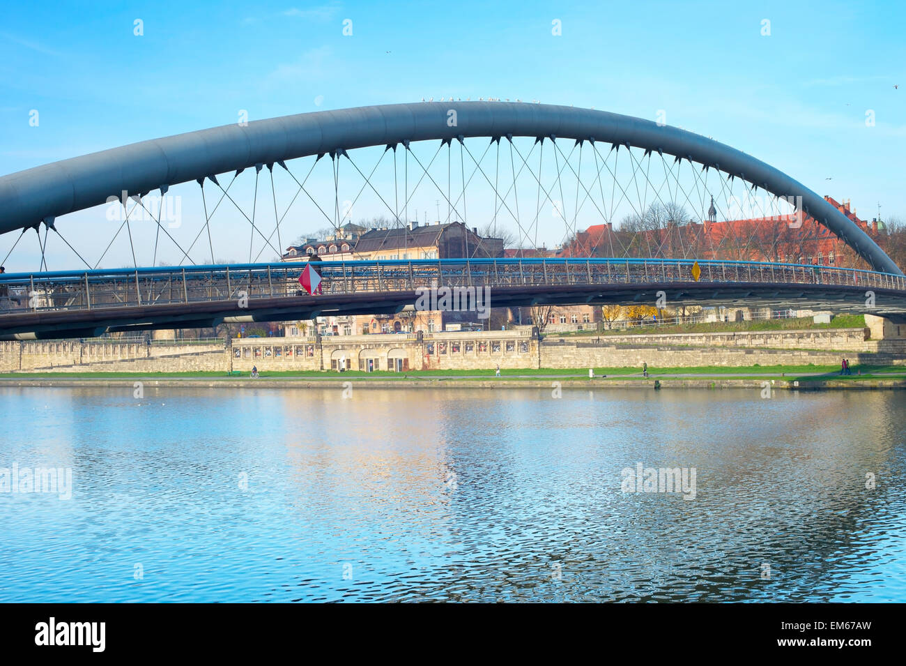 Side view of Father Bernatek Footbridge across the Wisla river. Krakow ...