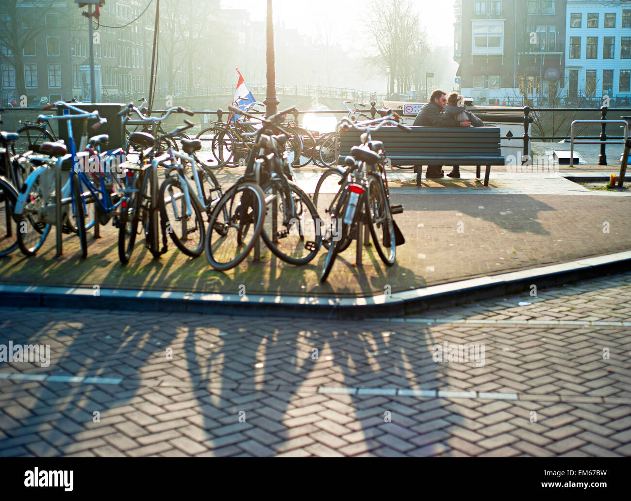 Couple on the bench in Amsterdam Stock Photo - Alamy